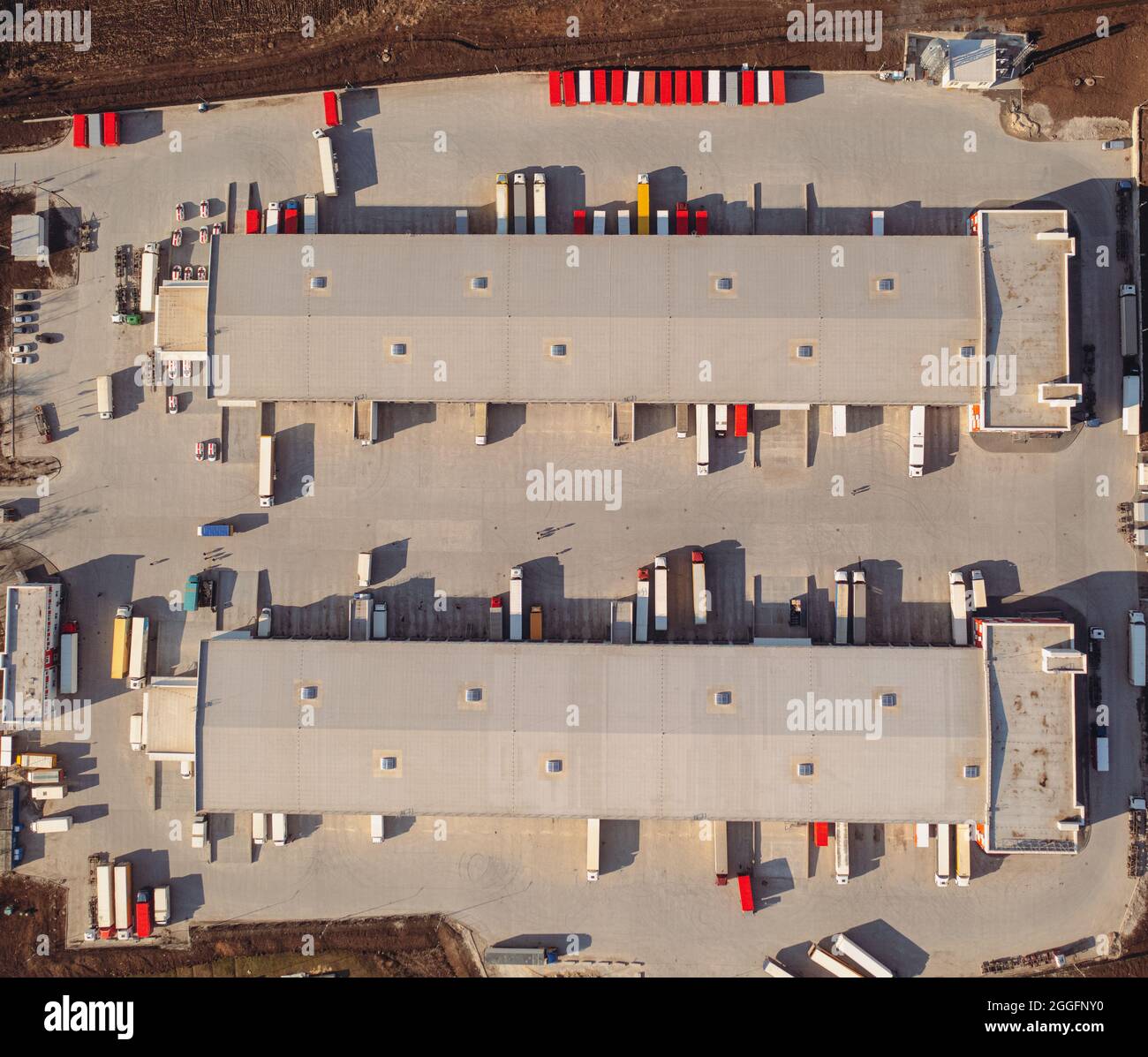 Trucks with trailers wait for the loading of goods for transportation ...