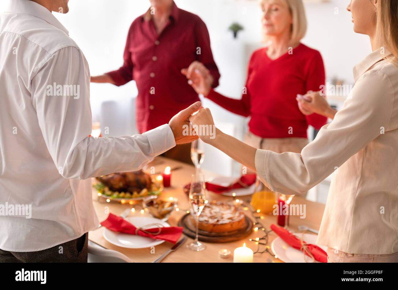 Closeup of young family celebrating Thanksgiving or Christmas with ...