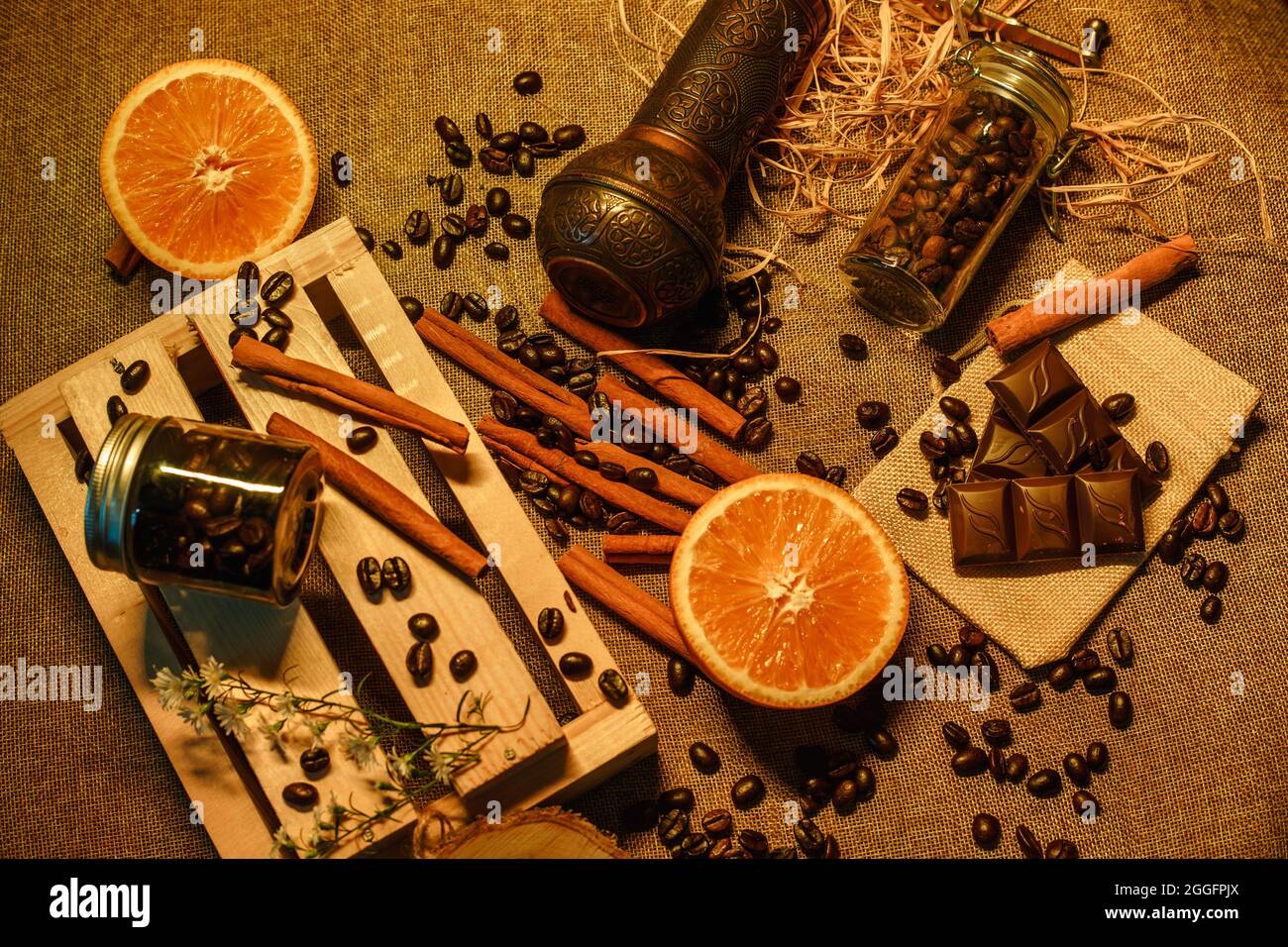 Top view of coffee beans with orange, chocolate,coffee grinder and ...