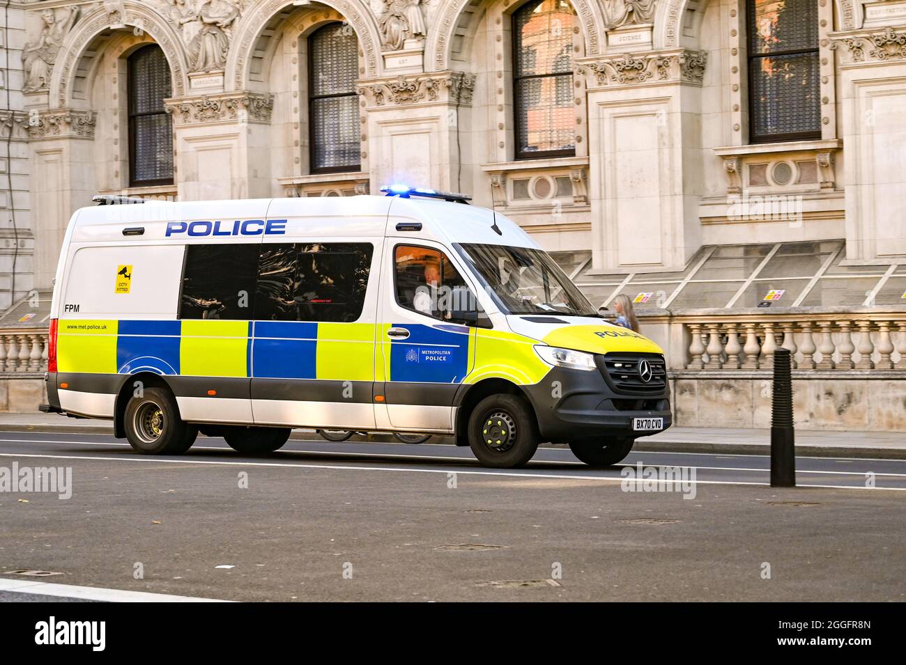 London, England - August 2021: Police van with blue lights flashing ...