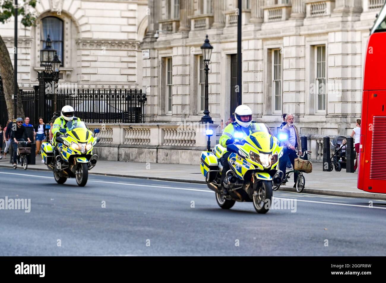London, England - August 2021: Police officers on motorbikes with blue ...
