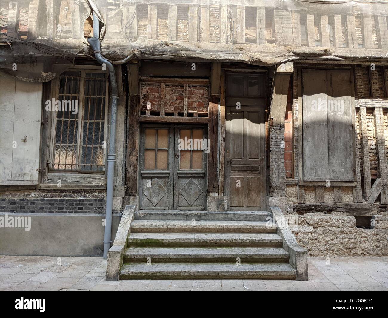 An old half-timbered building awaiting restoration in Troyes, France ...