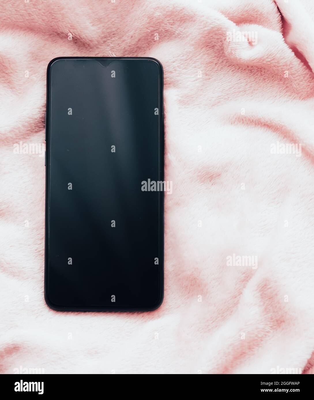 New mobile phone model on soft pink fabric background, smartphone ...