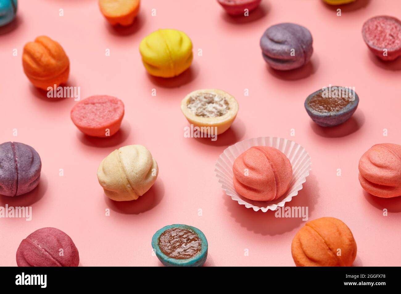 Colorful shortbread cookies with filllings on pink background Stock ...