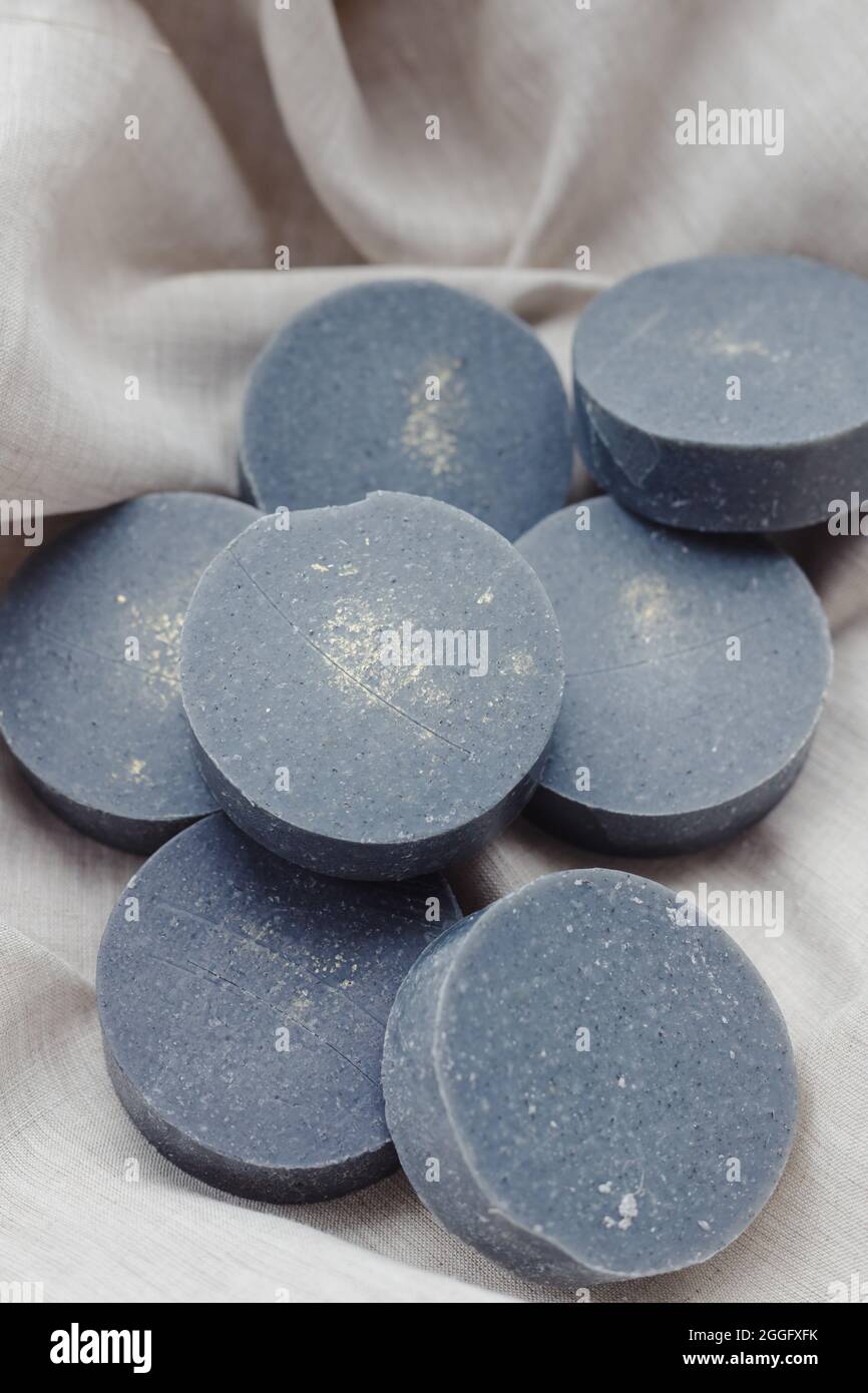 Handmade solid shampoo and conditioner bars on paper background. Copy ...
