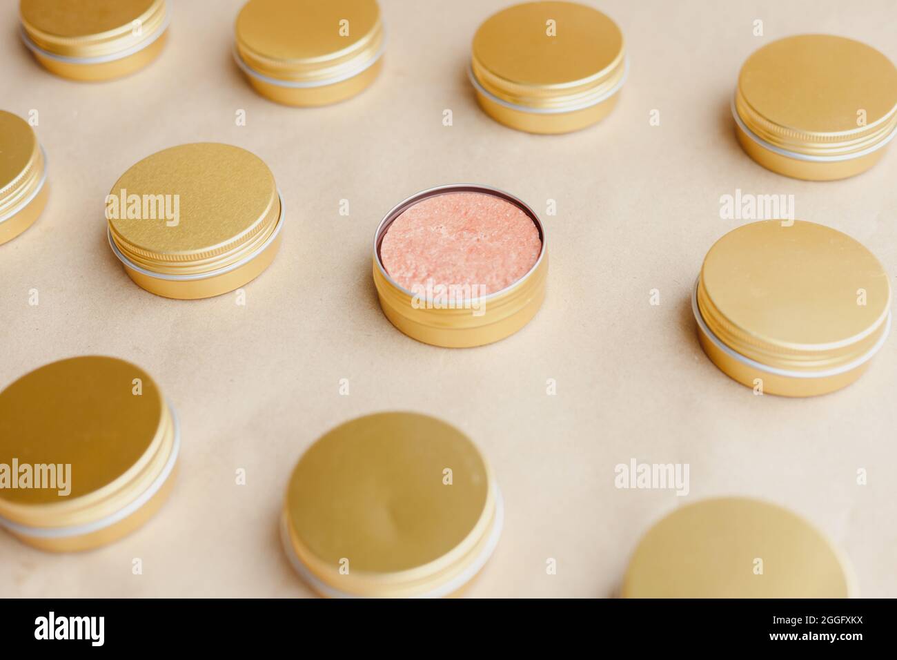 Eco friendly natural solid shampoo in metal cans on papaer background ...