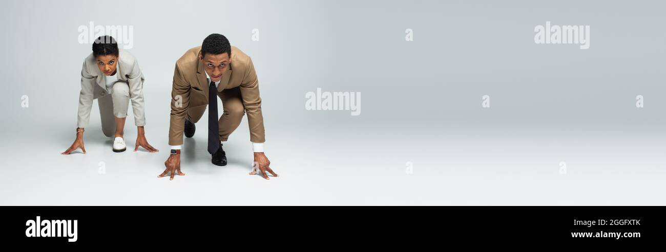 african american business people in starting pose before running on ...