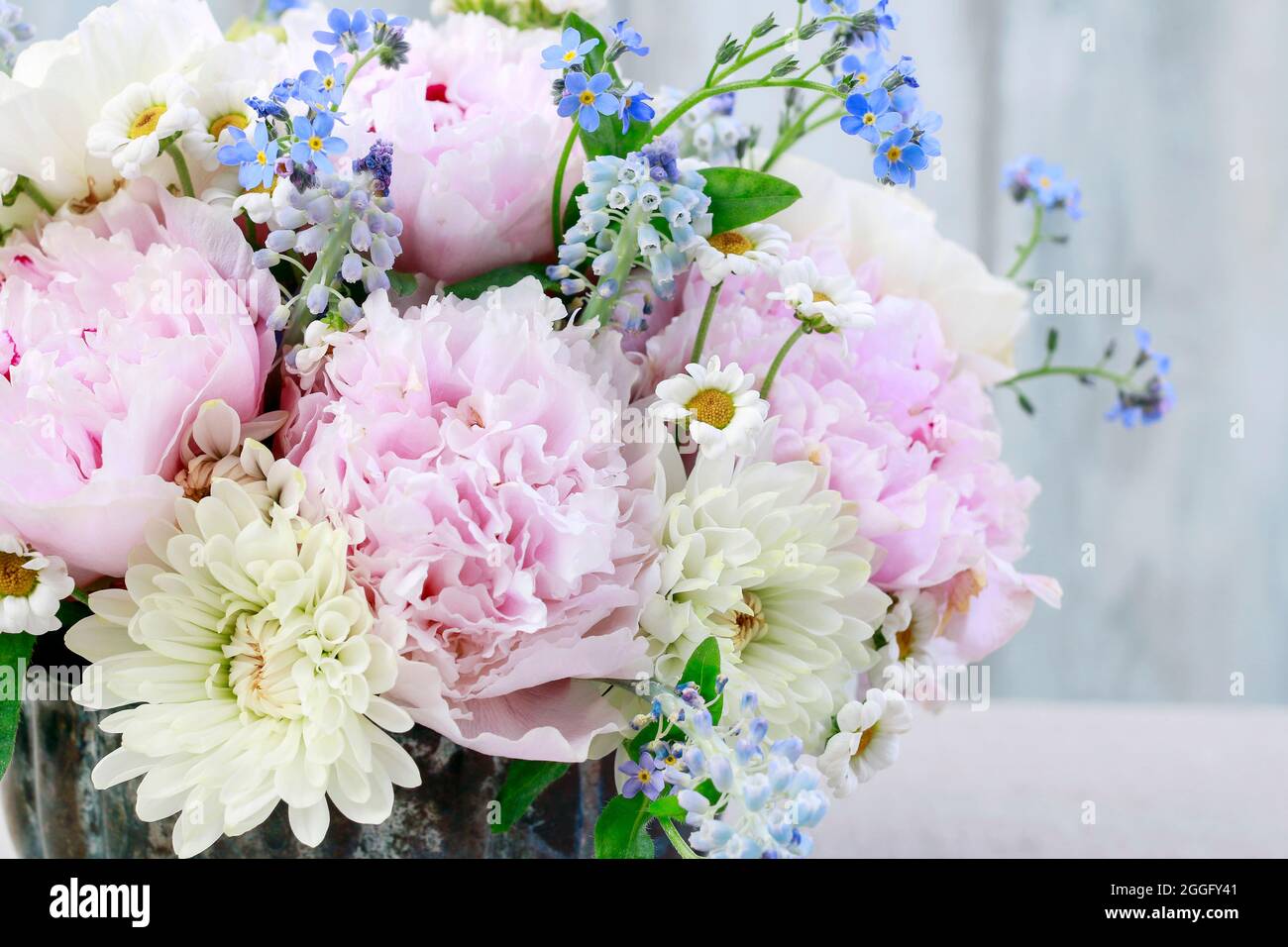 Floral arrangement with pink peonies, ranunculus flowers, white ...