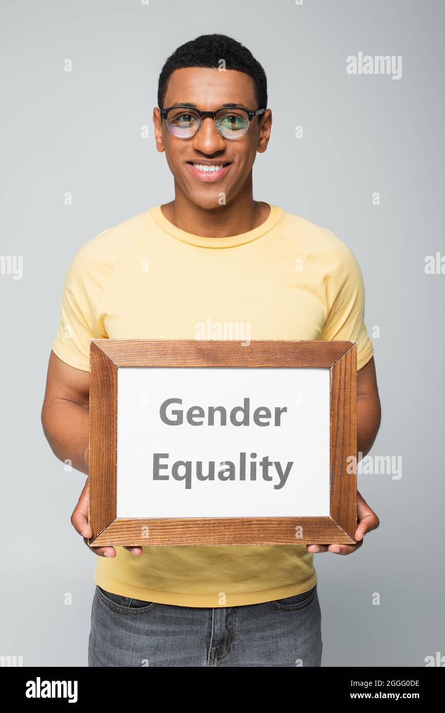 happy african american man holding placard with gender equality ...