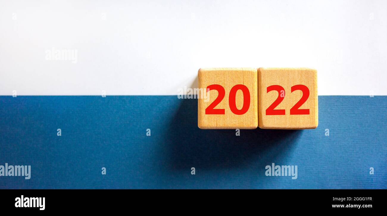 2022 happy new year symbol. Wooden cubes symbolize the change from 2021 ...