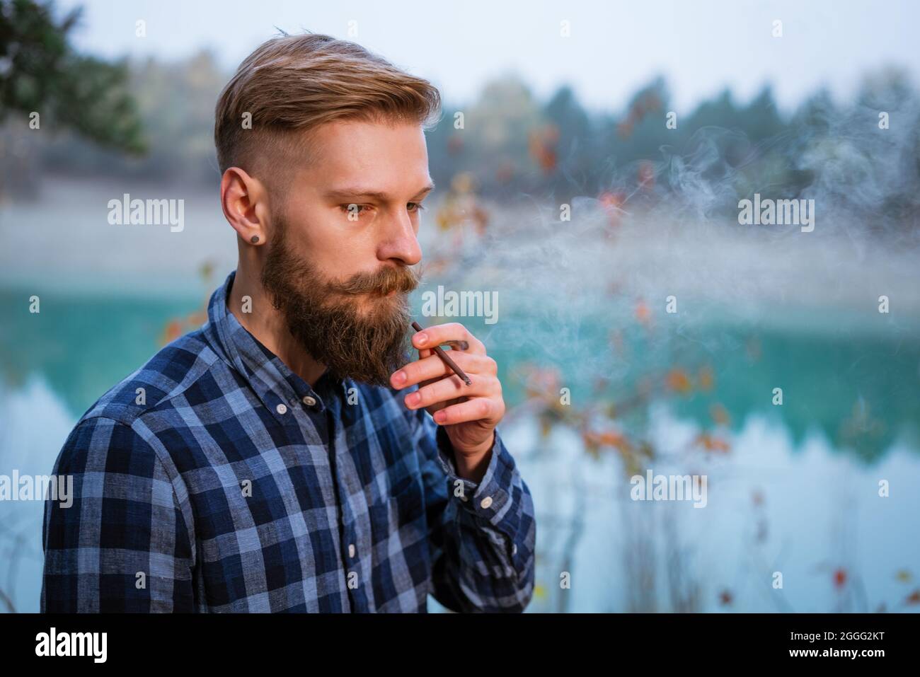 Bearded brutal male smoking hi-res stock photography and images - Alamy