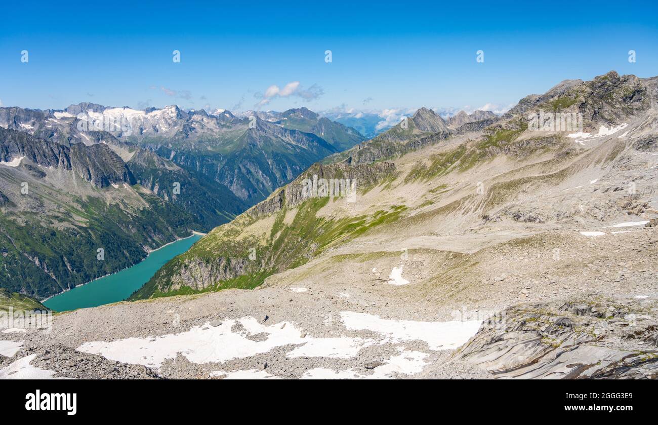 Summer alpine scenery with turquoise blue water reservoir. Zillertal ...