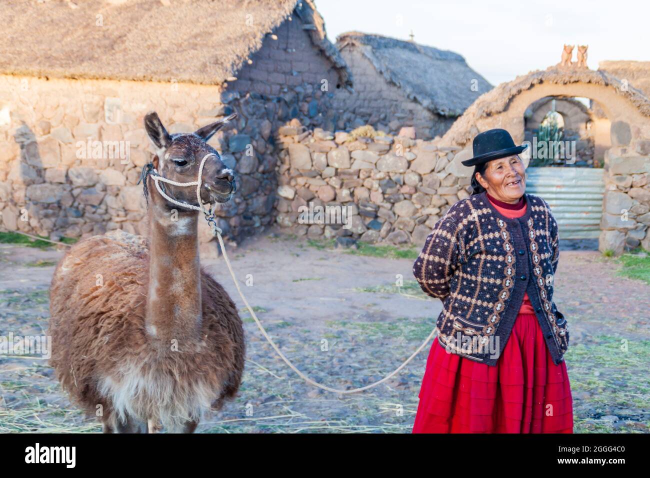 PUNO, PERU - MAY 14, 2015: Small settlement near Puno, Peru. Old women ...
