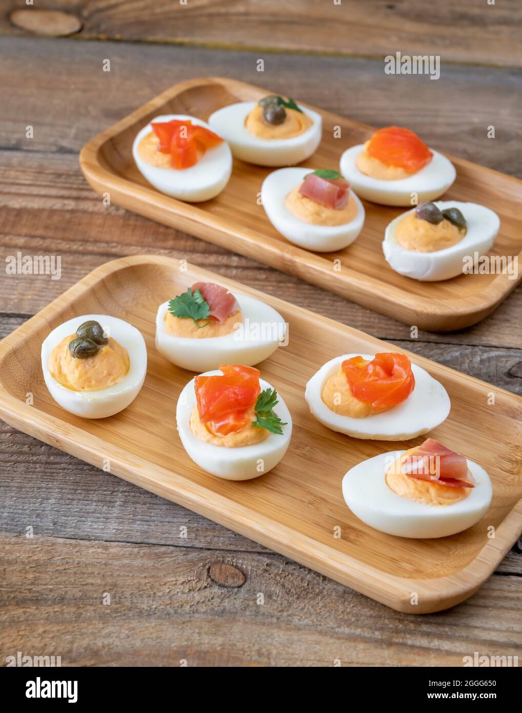 Sriracha deviled eggs with different toppings Stock Photo - Alamy