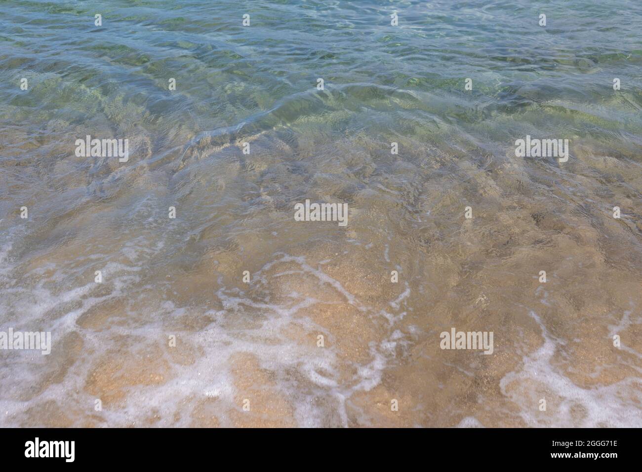 Wave on sand close up in tropical beach. Ocean water background Stock ...