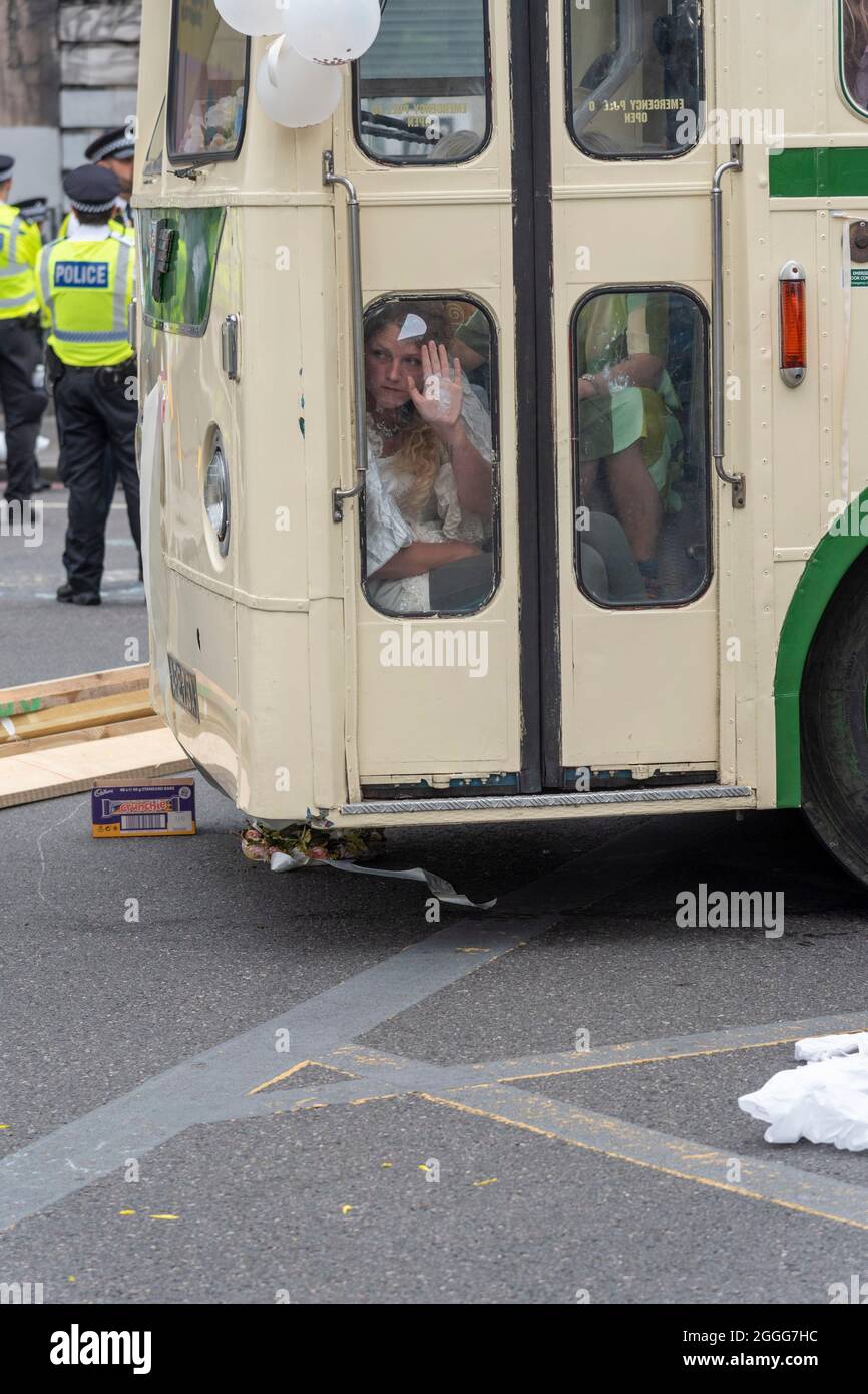 London, UK. 31st Aug, 2021. A protester with her hand superglued to the ...