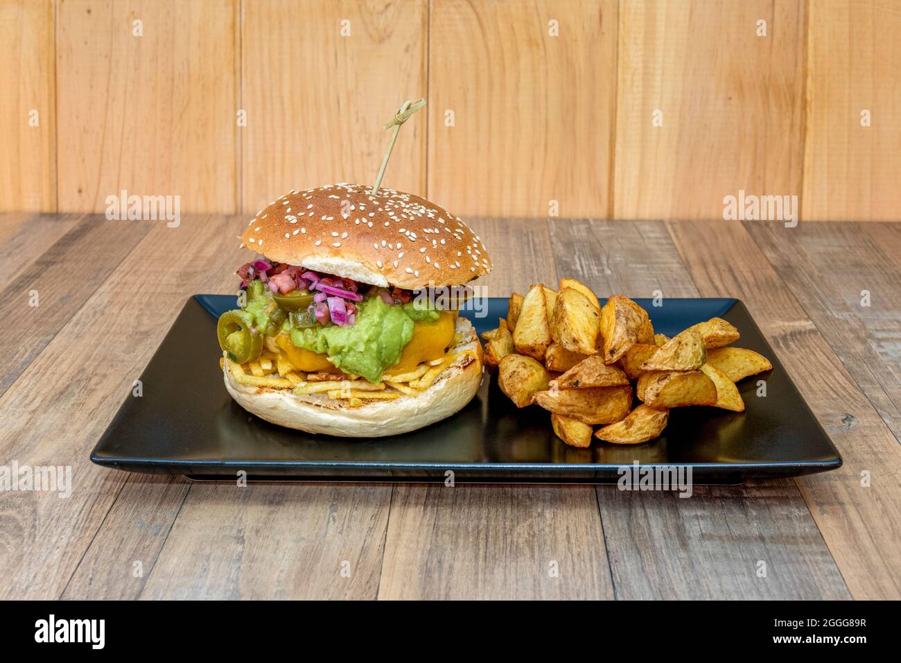delicious Mexican-style beef burger with guacamole and melted cheddar ...
