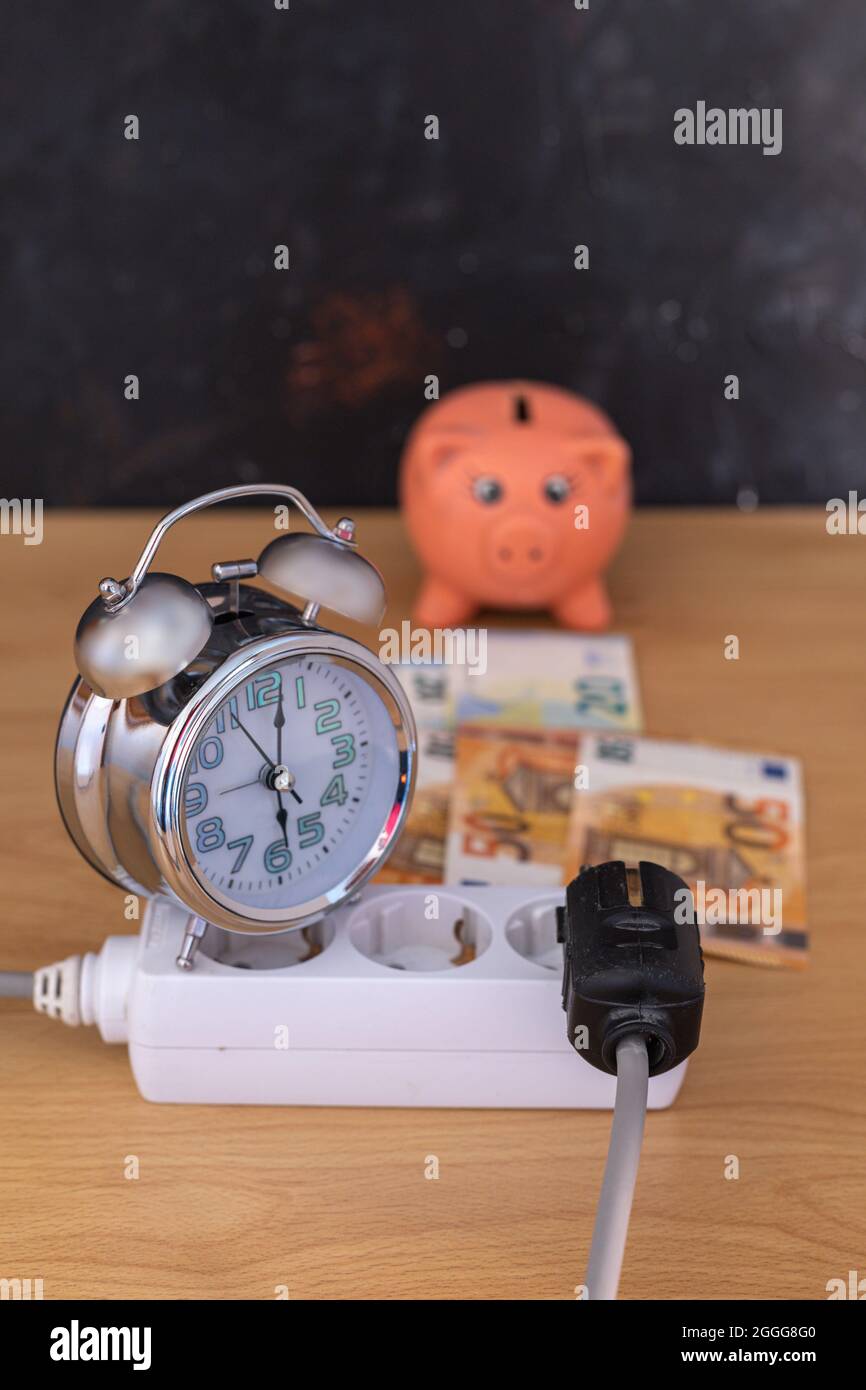 clock showing the time on a socket extension cord with different euro ...