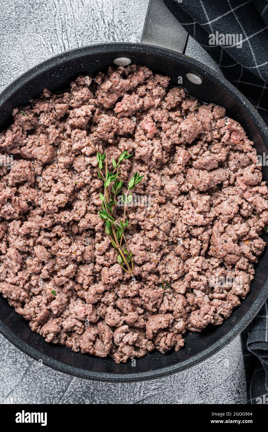 Fried mince beef and lamb meat in a pan with herbs. White background ...