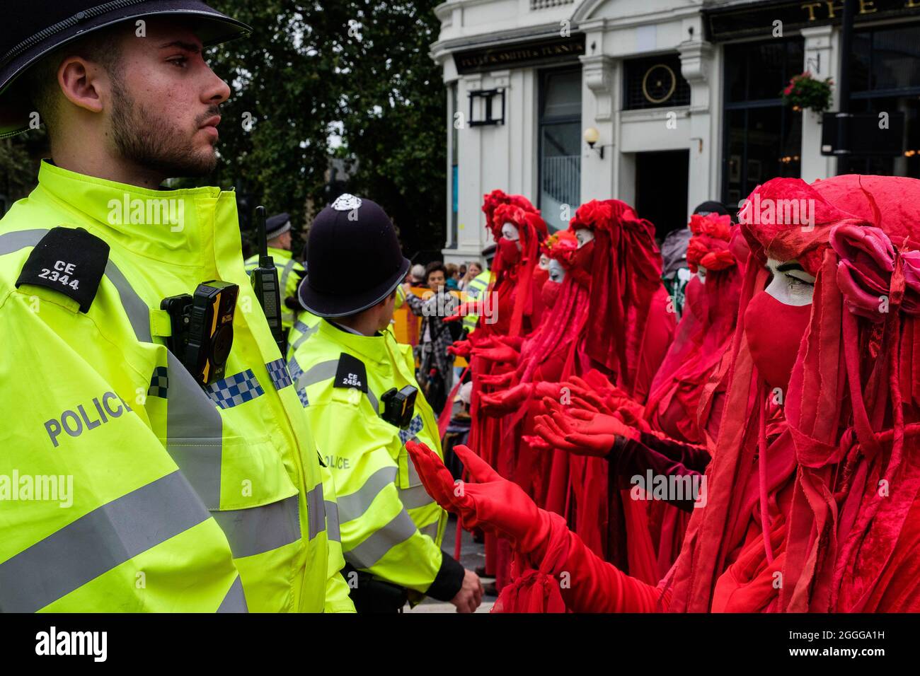 London, UK. 31st August 2021. Red Rebel Brigade faces the police ...