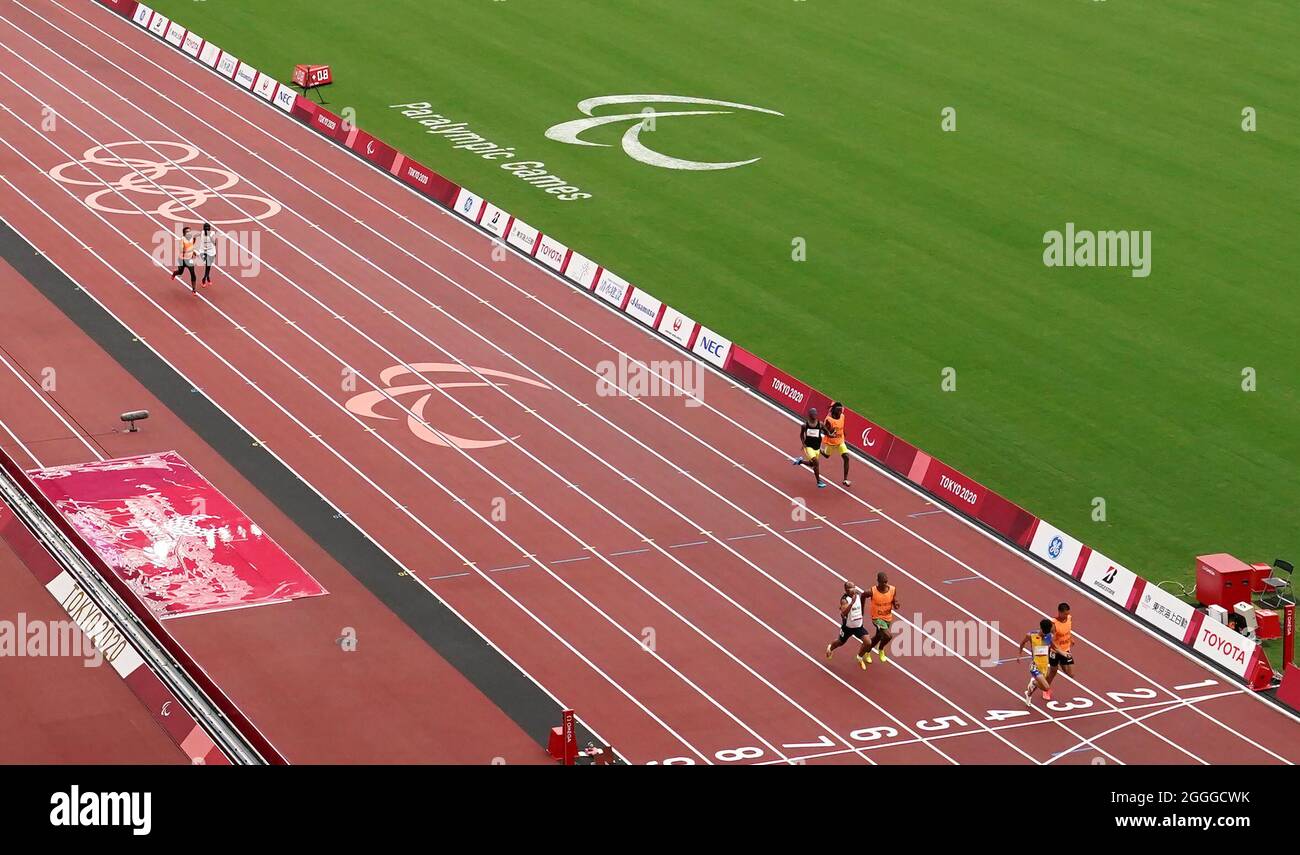 China's Dongdong Di and guide Jiageng Lian on the way to winning the ...