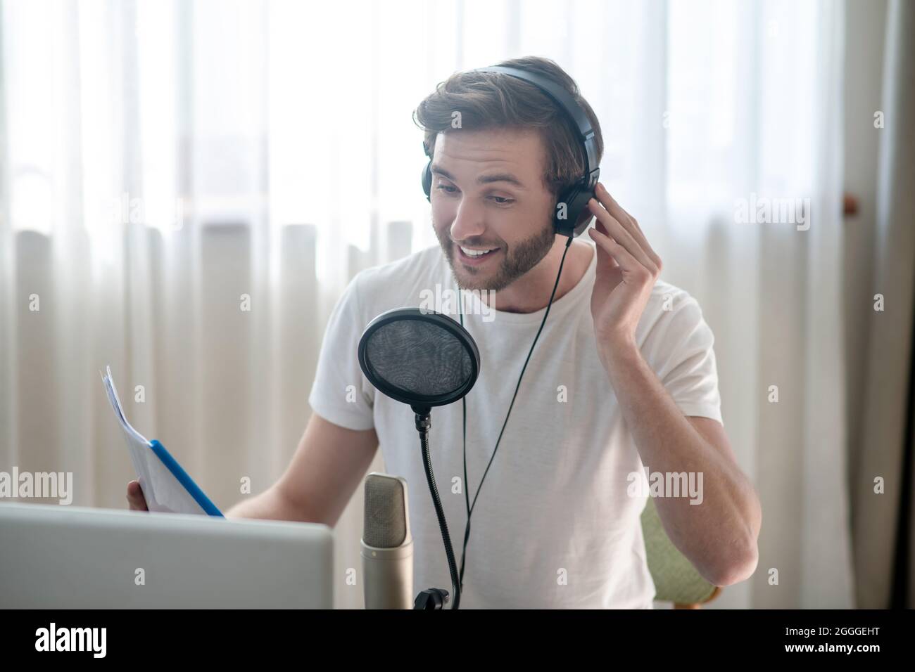 Young man speaking in podcast hi-res stock photography and images - Alamy