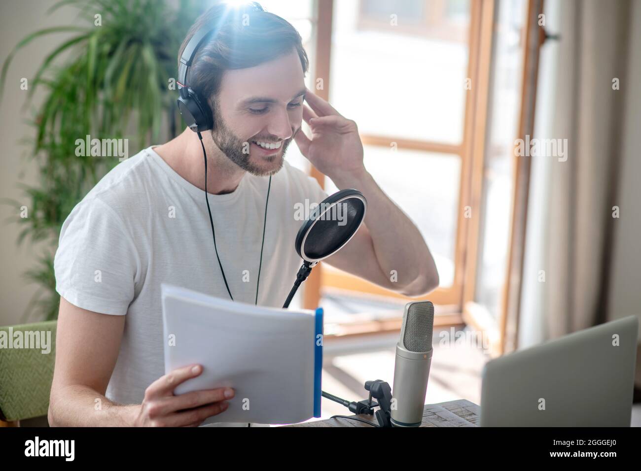Young man speaking in podcast hi-res stock photography and images - Alamy