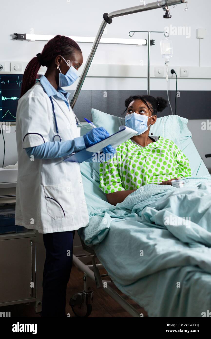Black woman laying in bed hi-res stock photography and images - Alamy