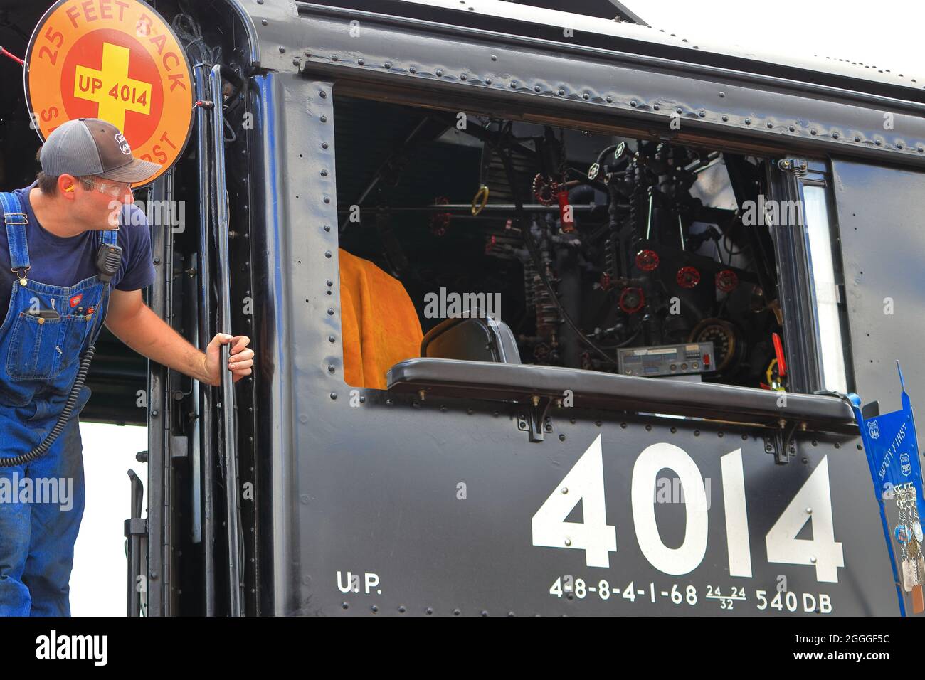 An engineer stands in the doorway to the cab of the Union Pacific's #4014--the only operating ...