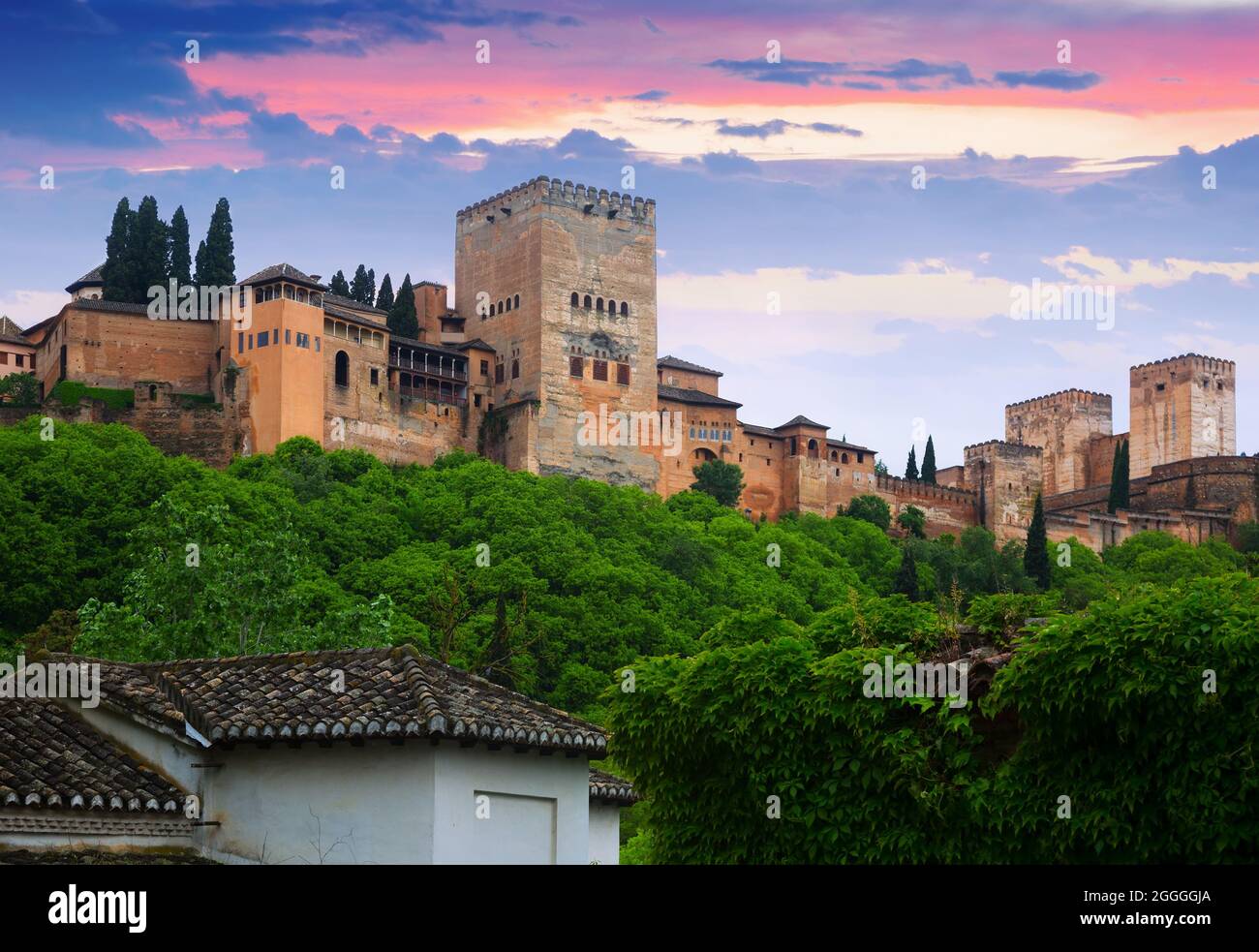 Towers of Alcazaba at Alhambra in sunset Stock Photo - Alamy