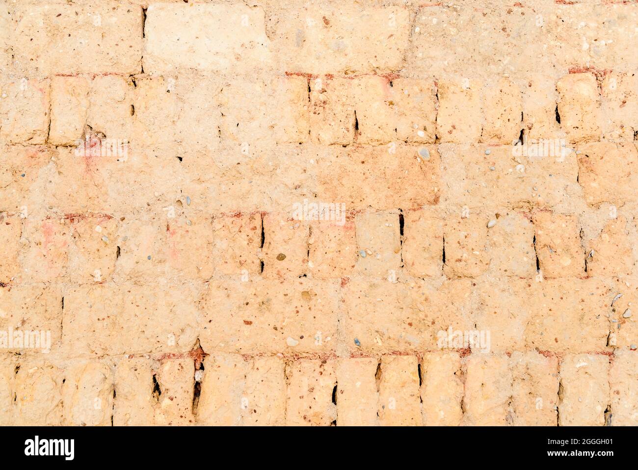 Yellow clay brick wall for textures and backgrounds Stock Photo - Alamy