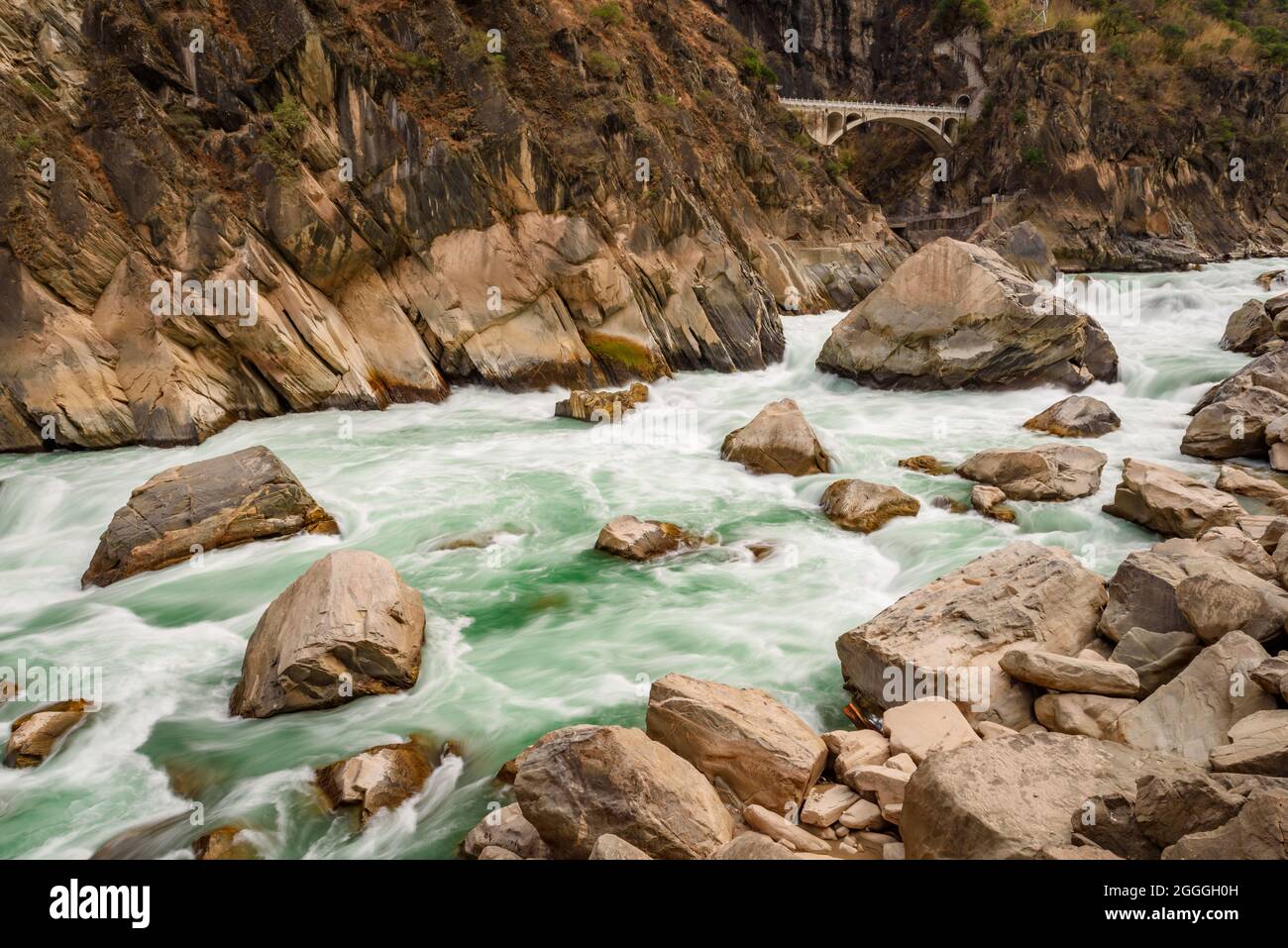 Fast flowing river at Tiger Leaping Gorge, a scenic canyon along Jinsha ...