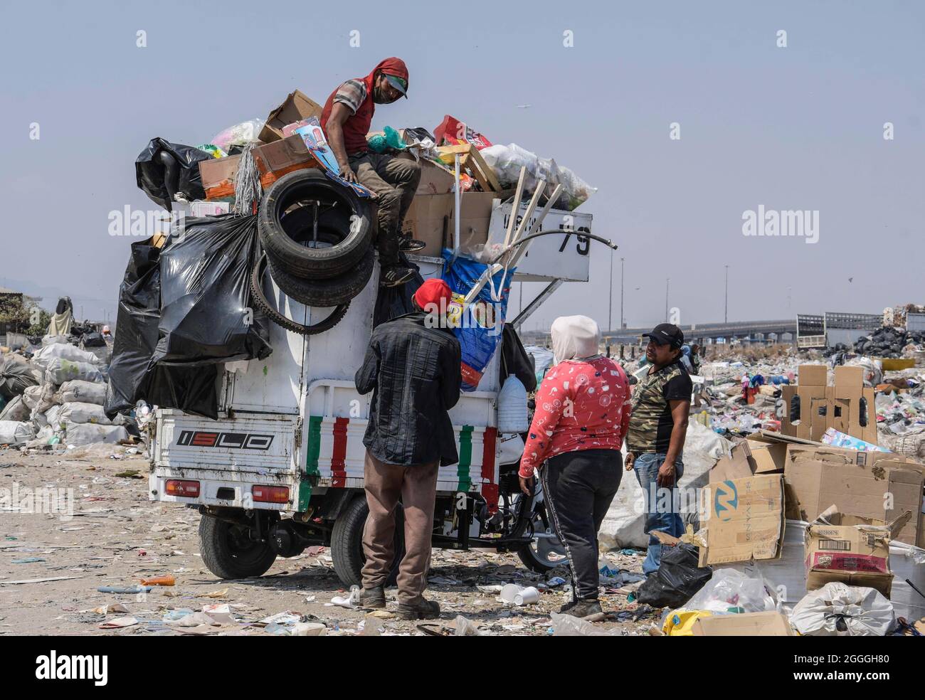 Non Exclusive: People during the collection and separation of waste ...