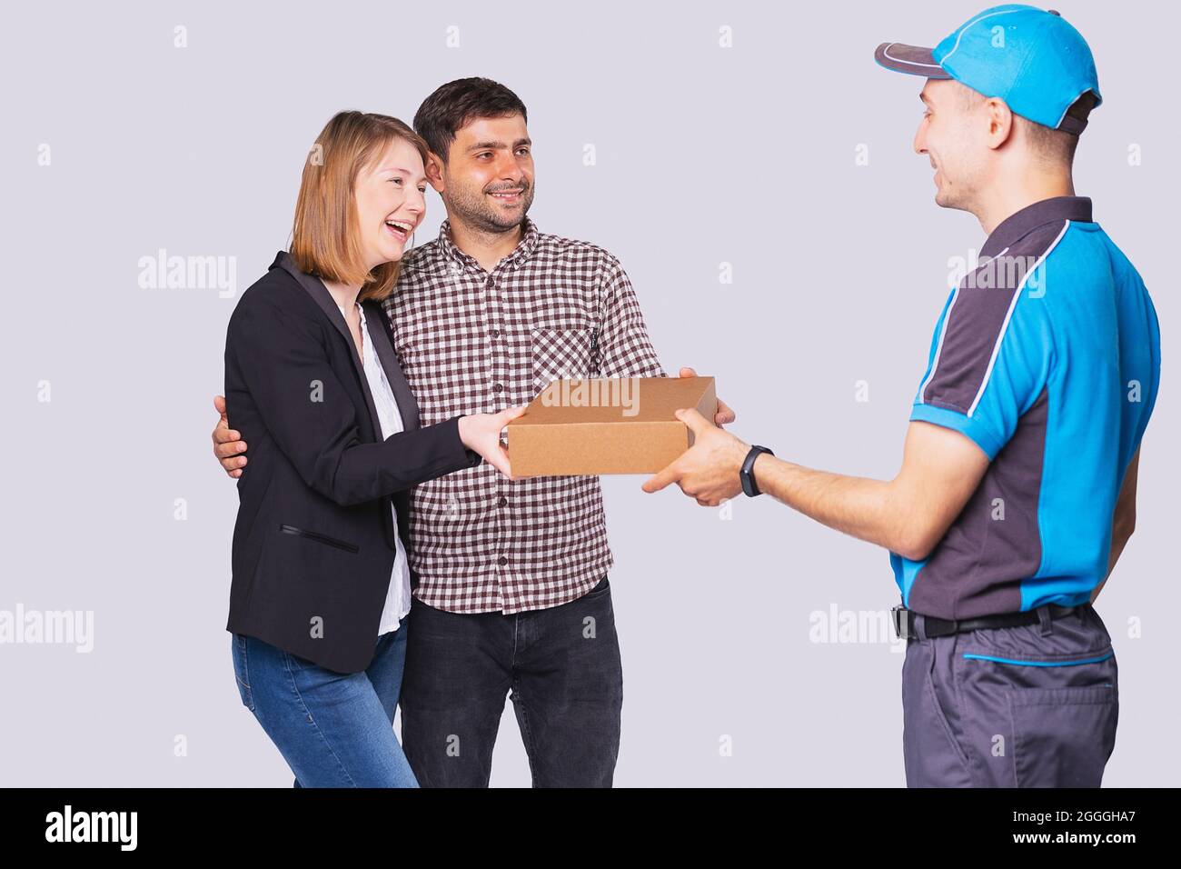 photo of three people, courier man in blue uniform and smart watch ...