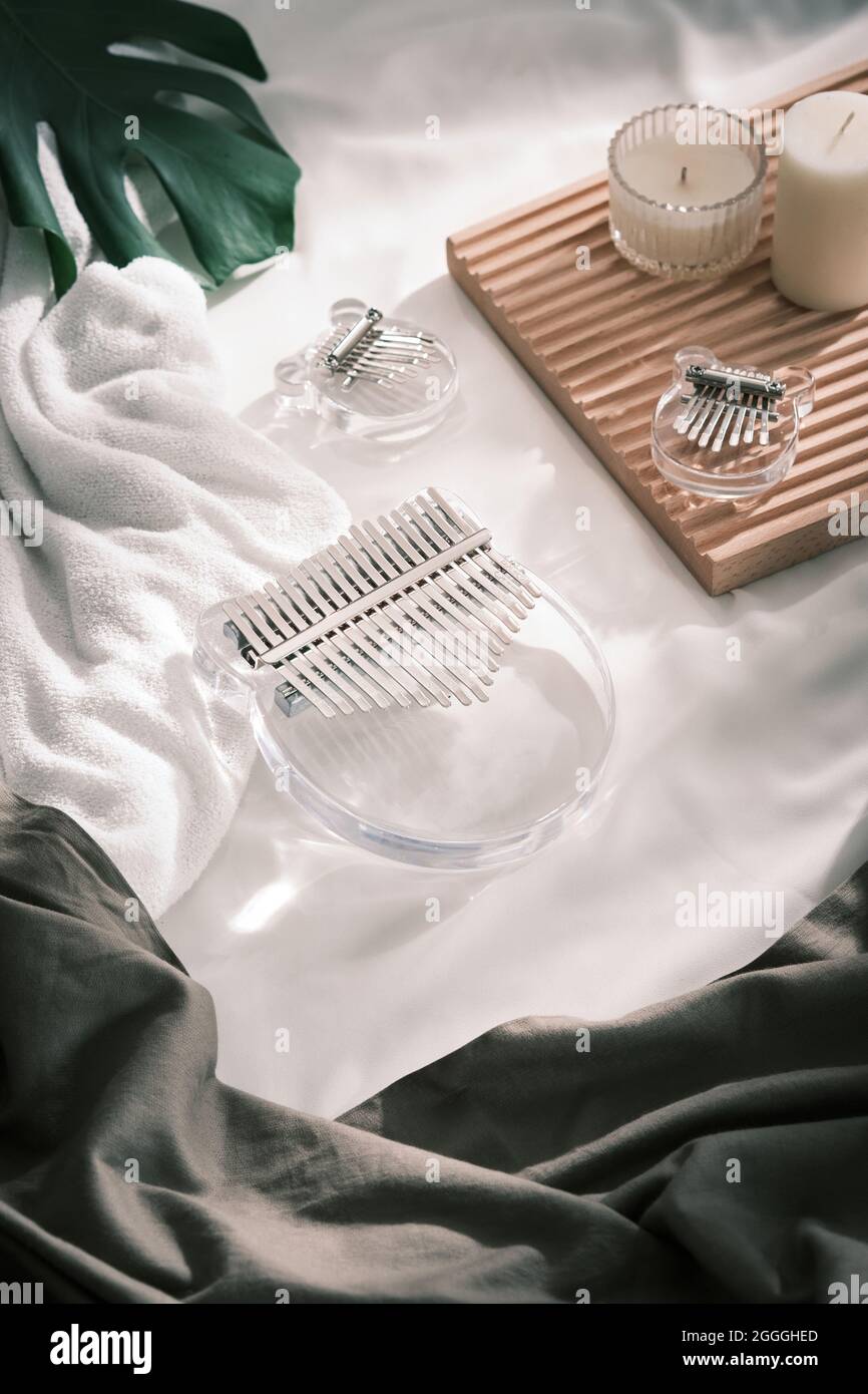 Relax and playing Glass Kalimba. Kalimba or mbira is an African musical ...