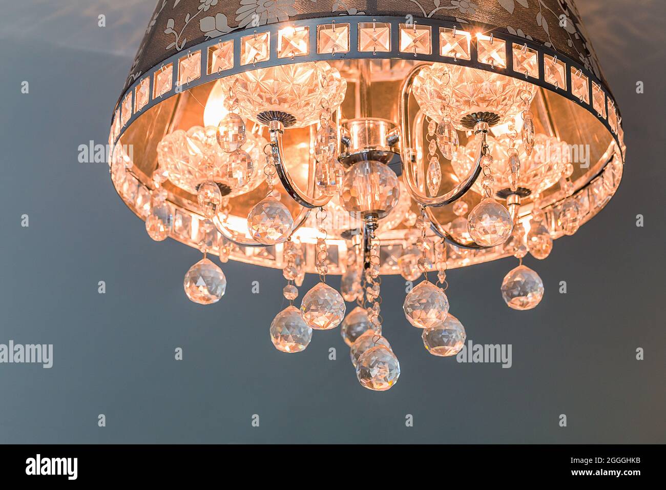 beautiful crystal chandelier with reflection and bokeh Stock Photo - Alamy