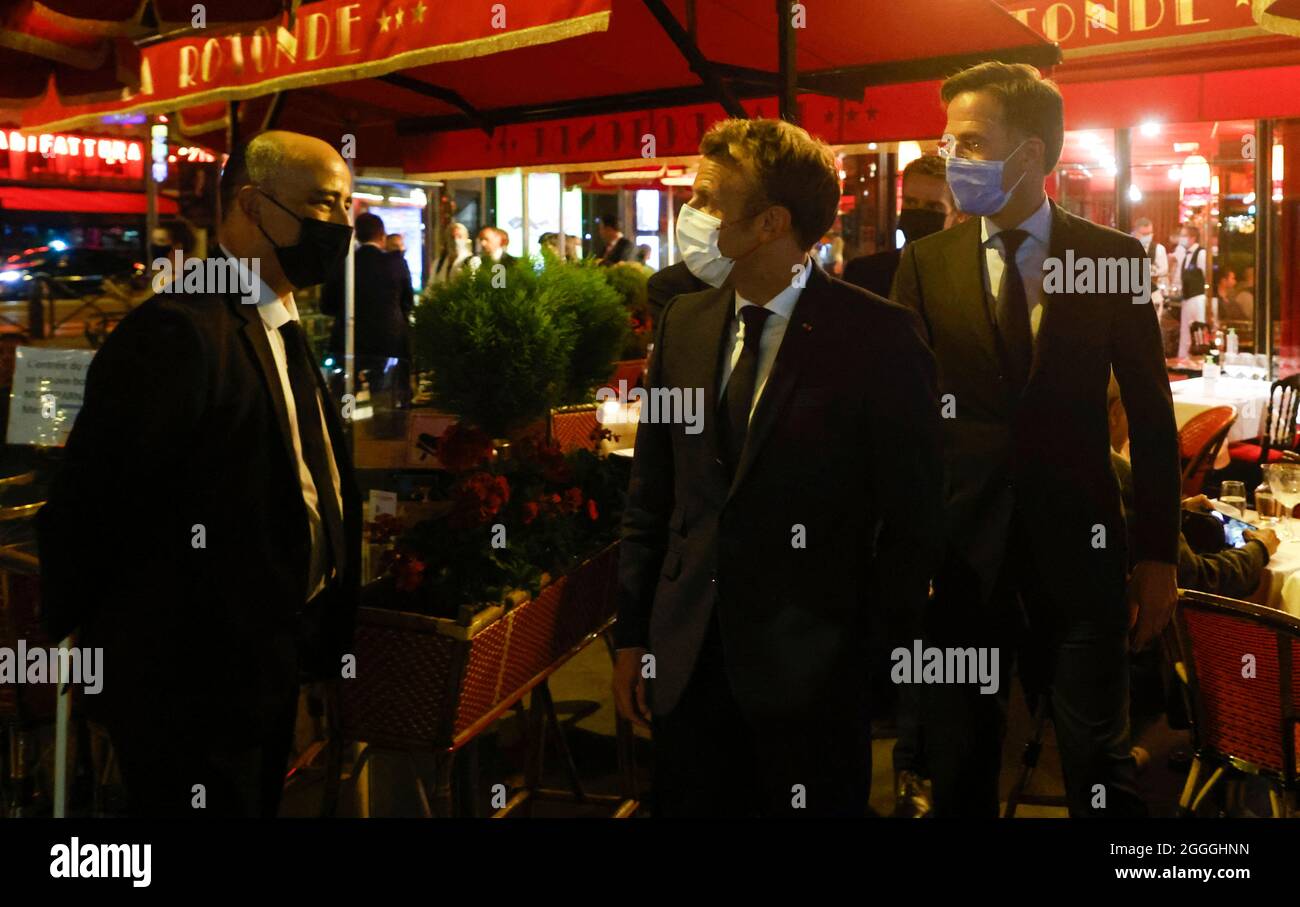 French President Emmanuel Macron (C) and outgoing Netherlands' Prime ...