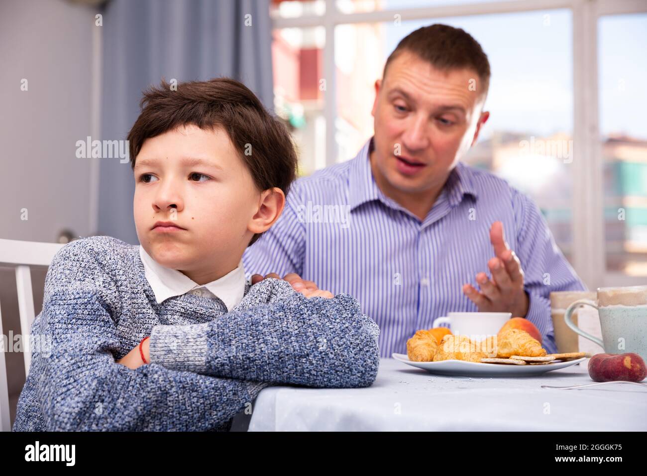 Troubled boy scolded by father Stock Photo - Alamy