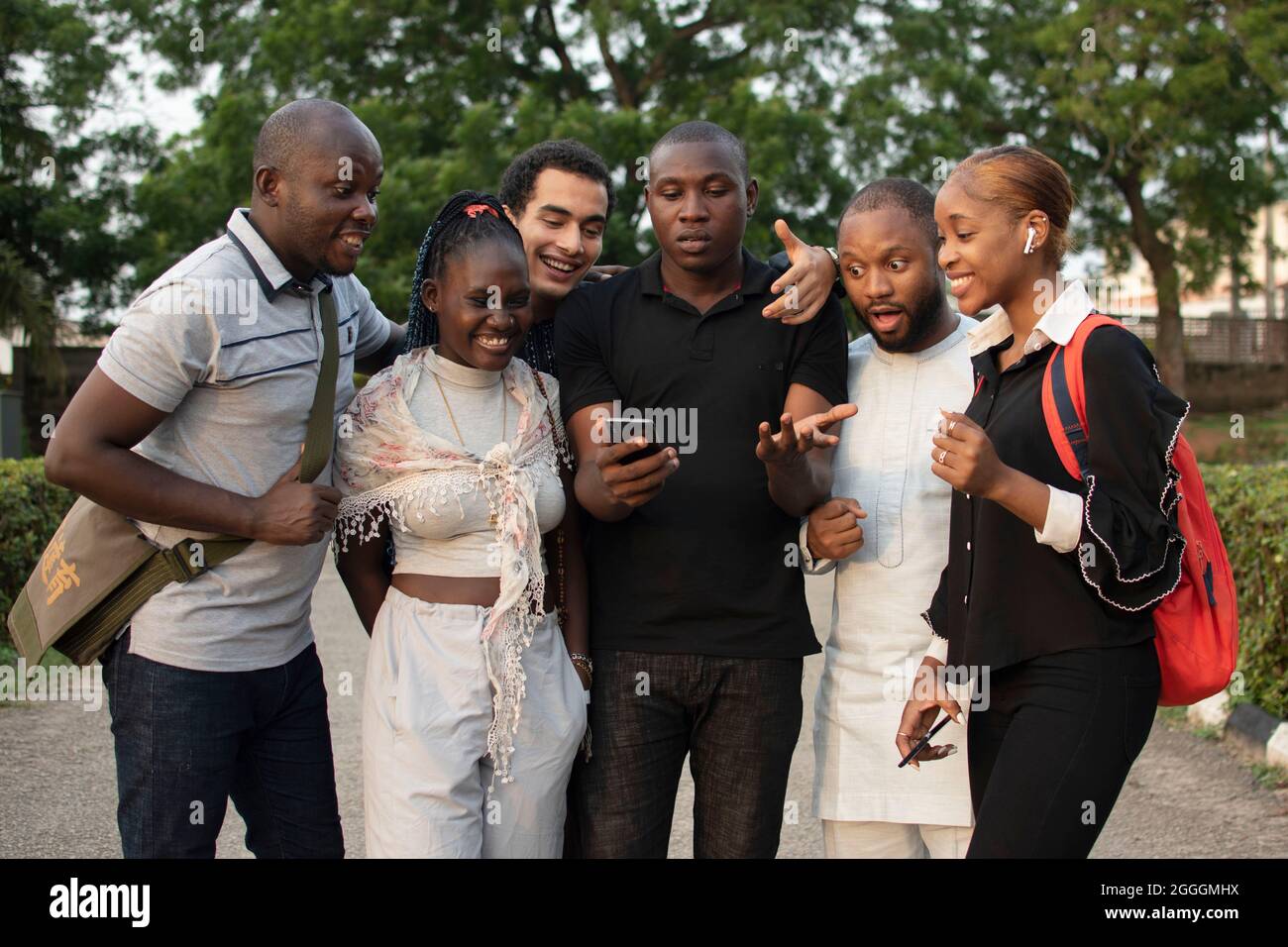 Group of african people looking at phone Stock Photo - Alamy