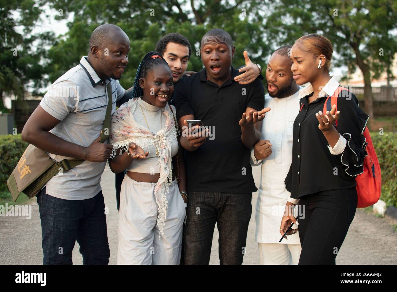 Group of african people looking at phone Stock Photo - Alamy
