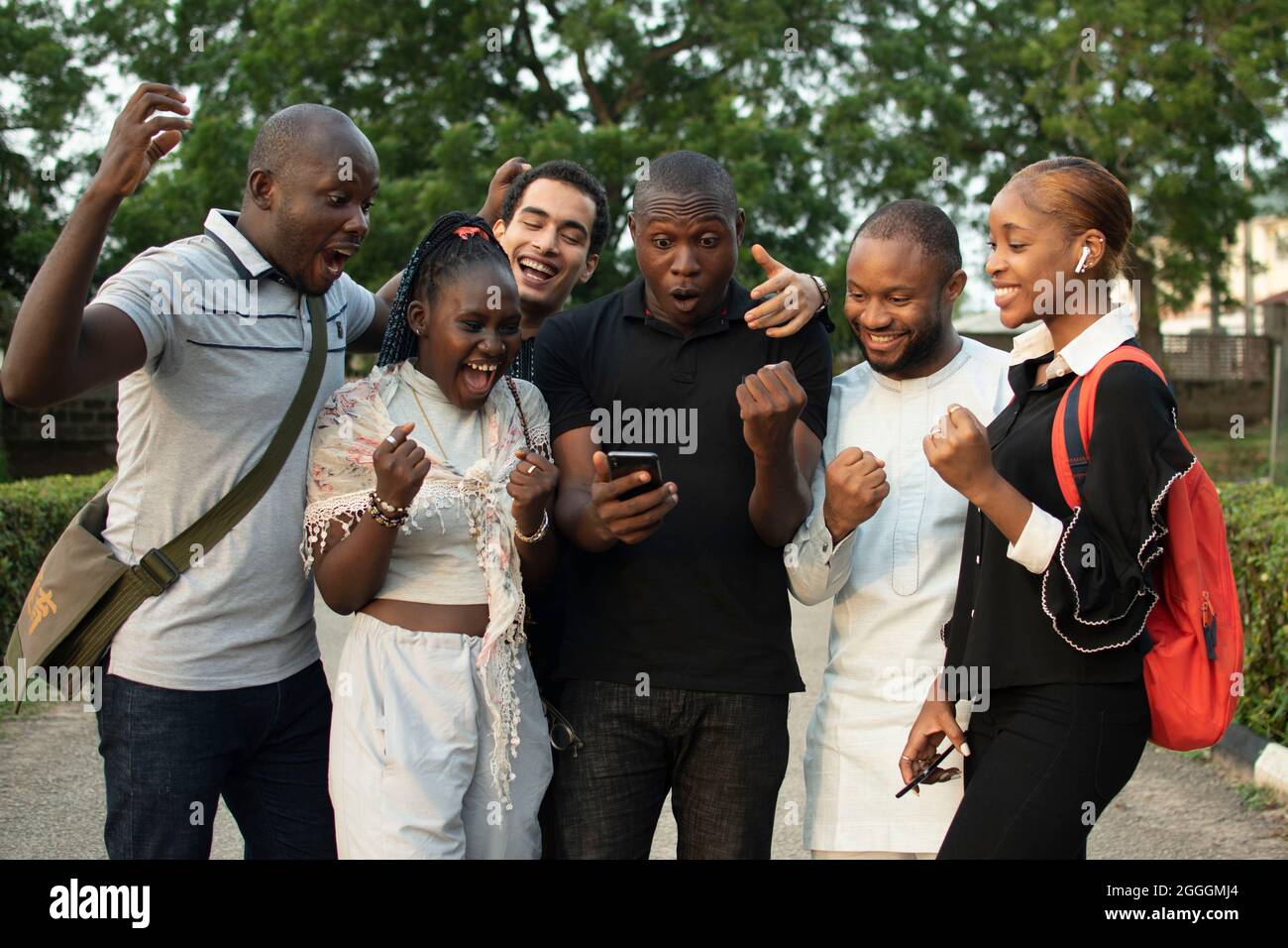 Group of african people looking at phone Stock Photo - Alamy