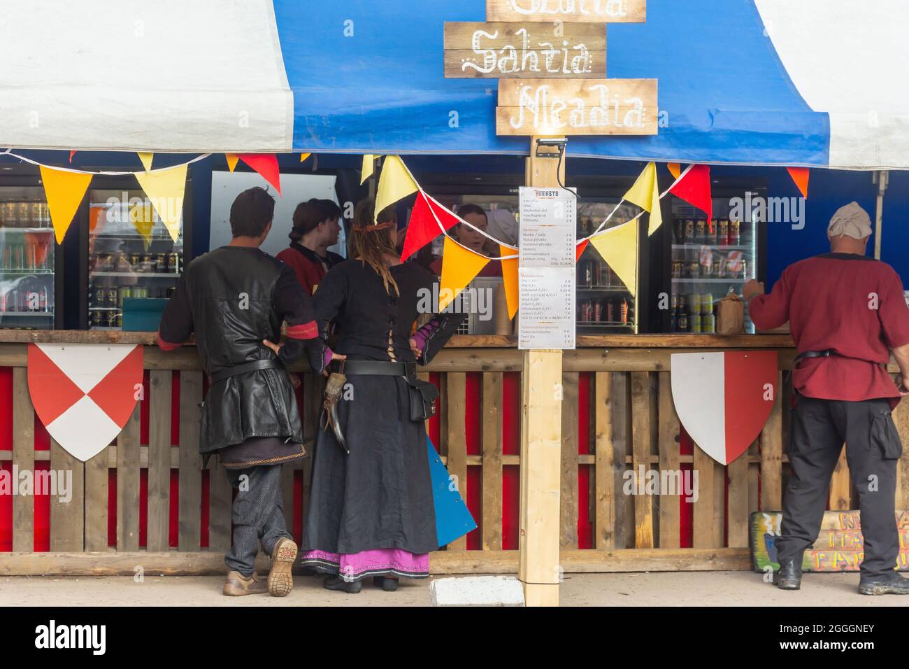 Couple buying traditional Finnish Meade (Sahti) at Medieval festival ...