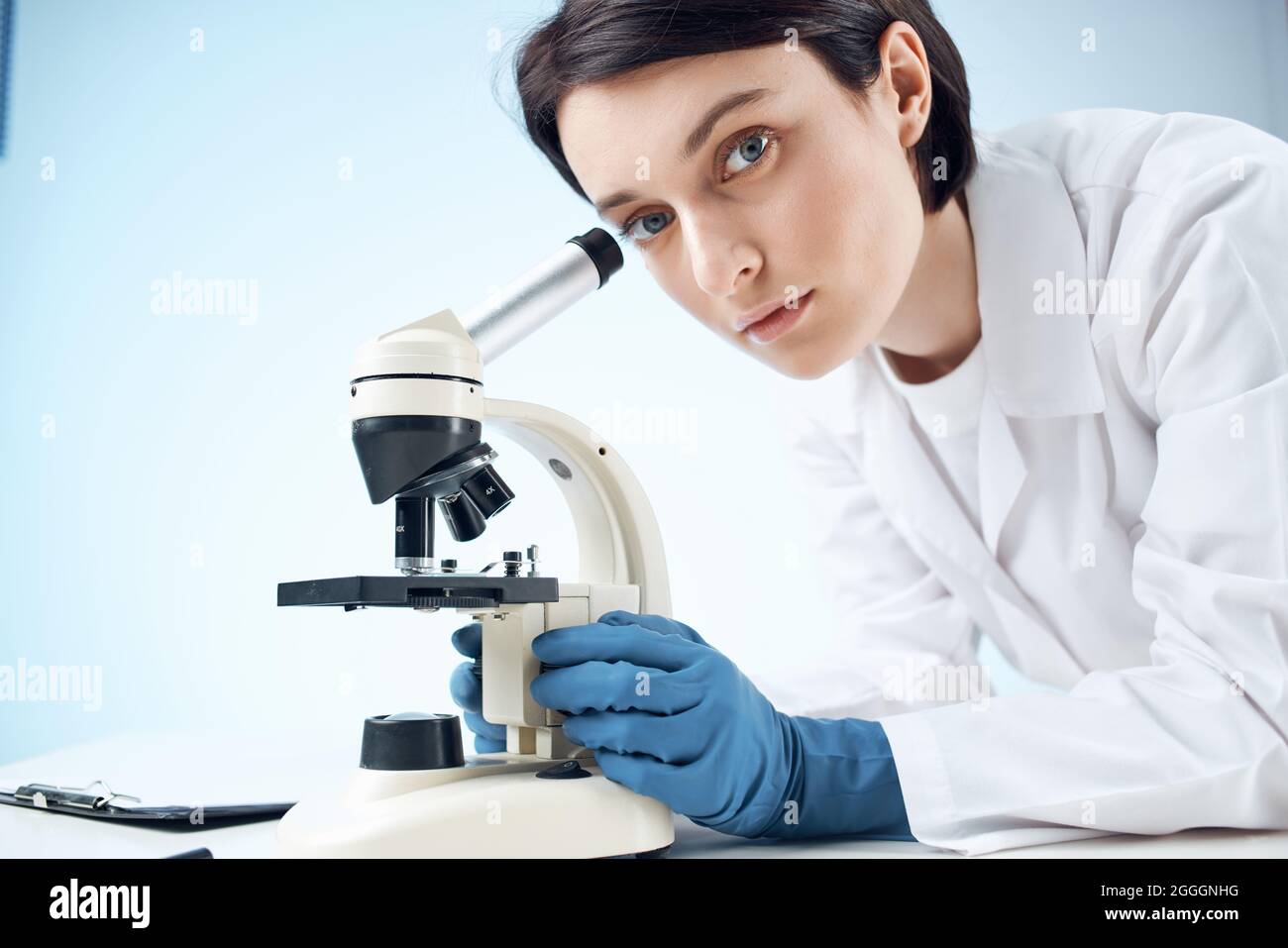 woman with microscope laboratory microbiology technology science Stock ...