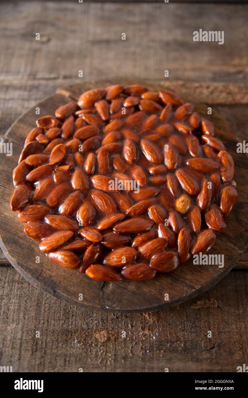 Typical and traditional sweet made from melted sugar and almonds Stock ...
