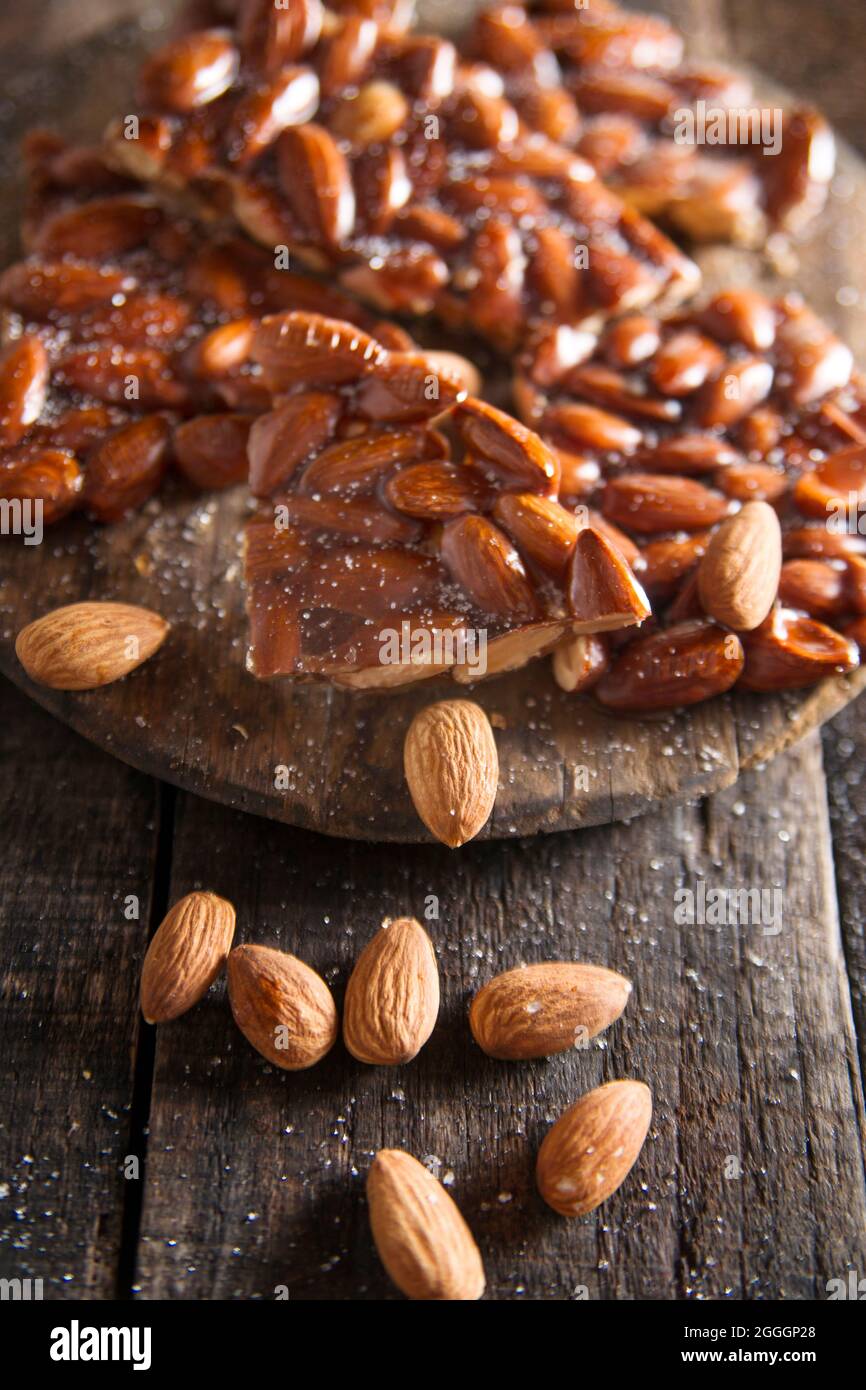 Typical and traditional sweet made from melted sugar and almonds Stock ...