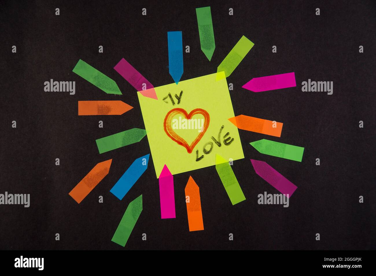 Post it colored with a drawn heart symbol of love Stock Photo - Alamy