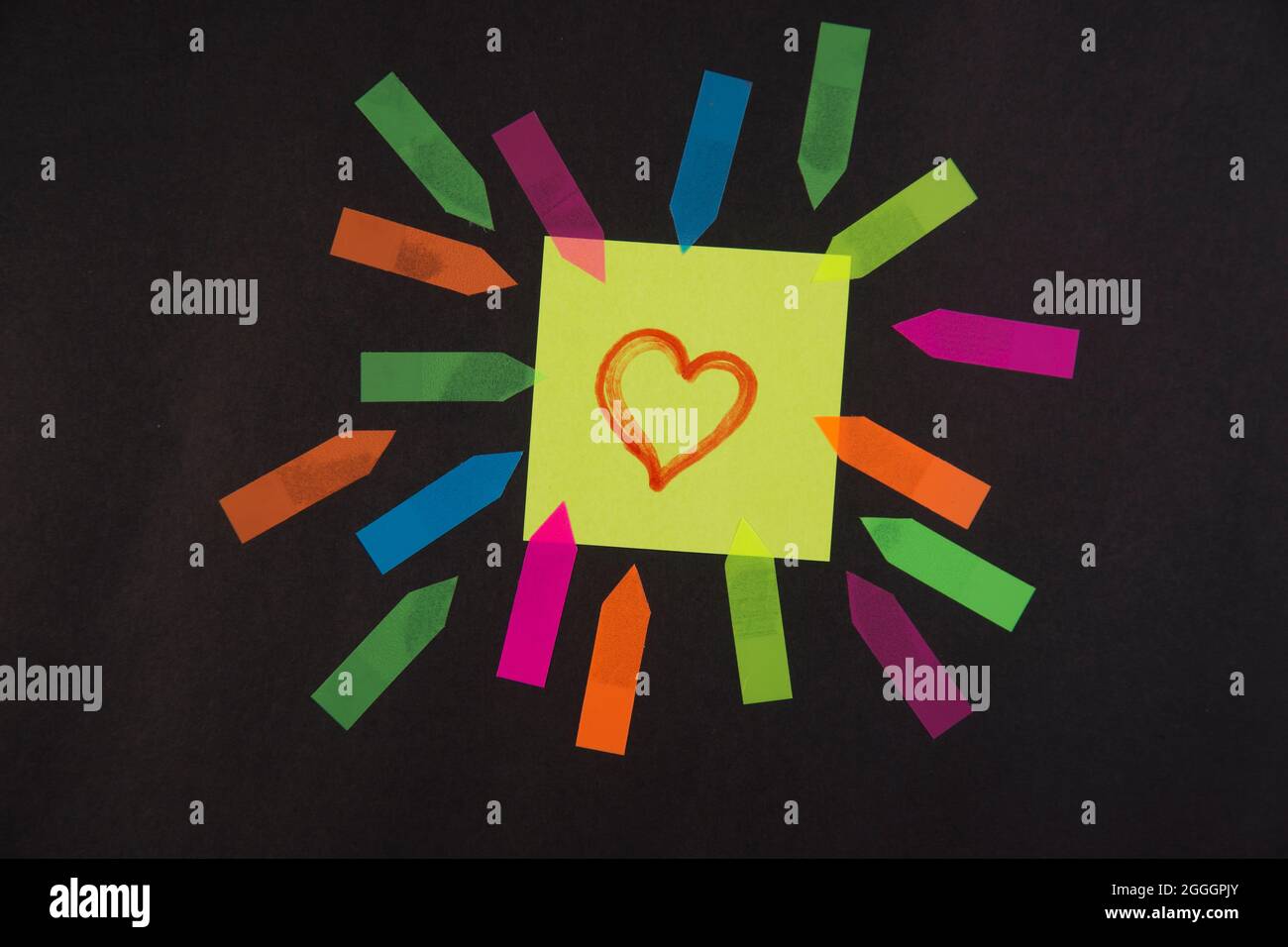 Post it colored with a drawn heart symbol of love Stock Photo - Alamy