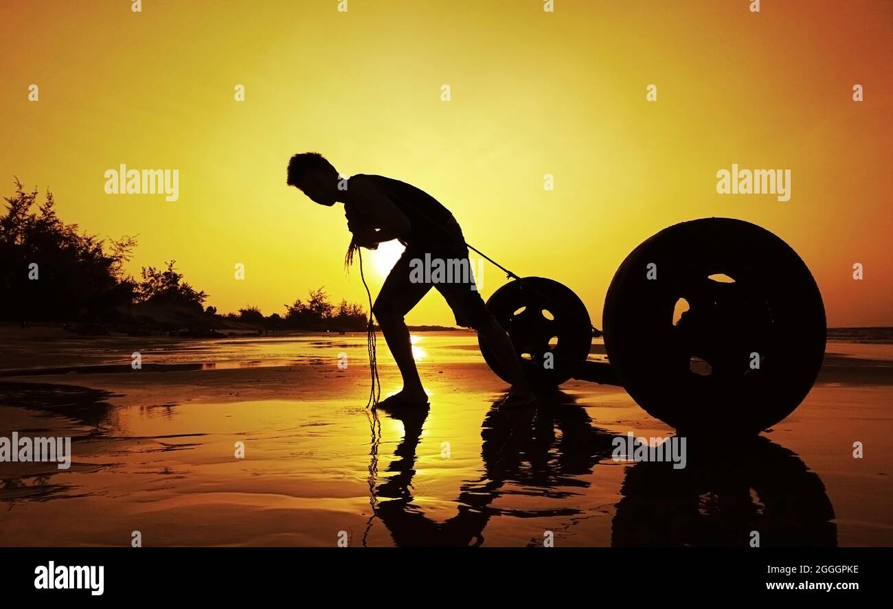 exercise on the beach at sunset Stock Photo - Alamy