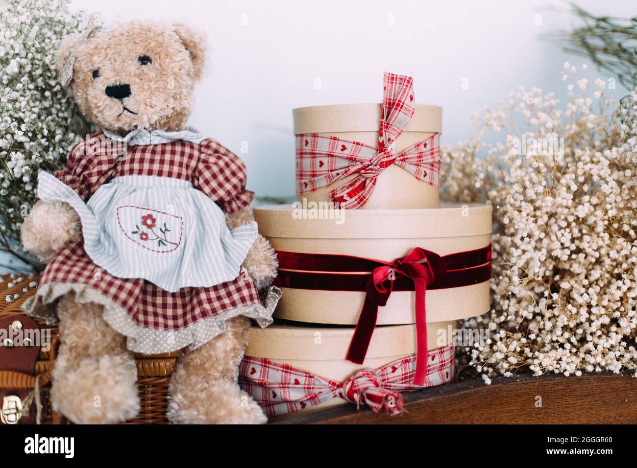 Festive packaging concept. Round boxes with gifts, decorated with a red ...