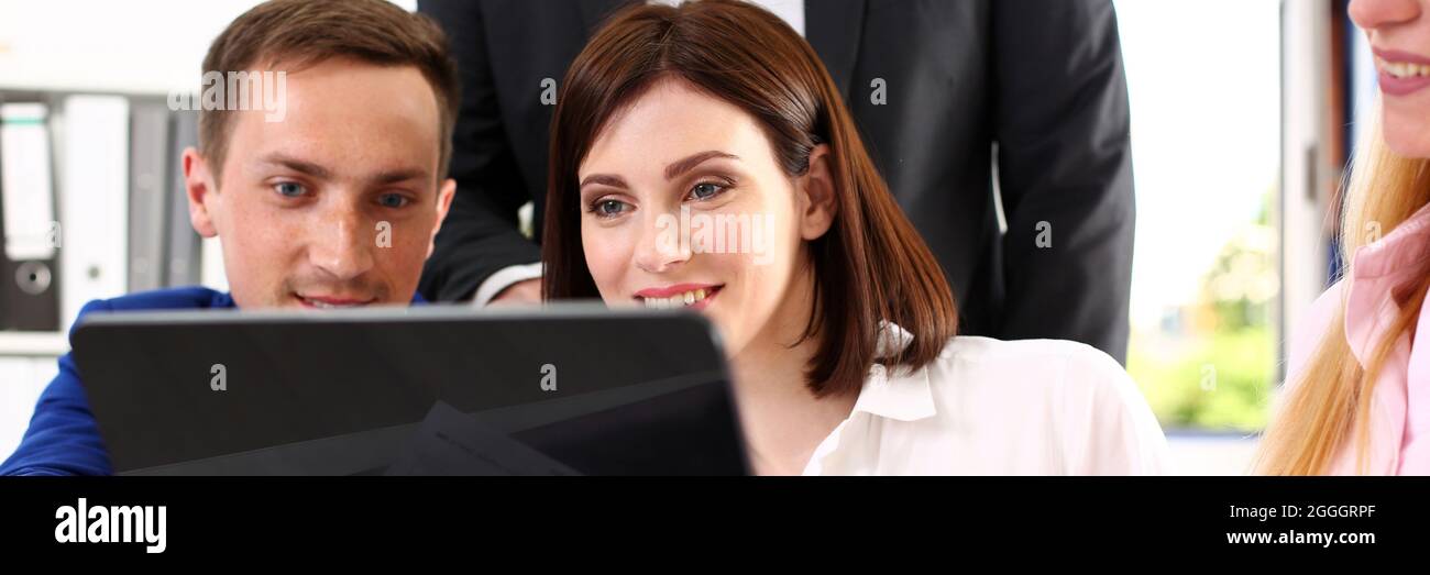 Group of people in office look at mobile tablet pc Stock Photo - Alamy